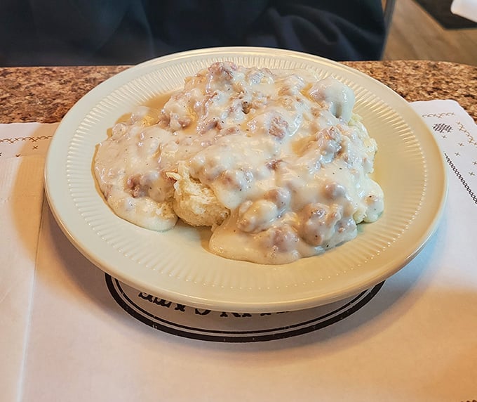 Biscuits drowning happily in sausage gravy—a Southern classic that's found its perfect Maryland home. Your arteries might protest, but your taste buds will send thank-you notes.