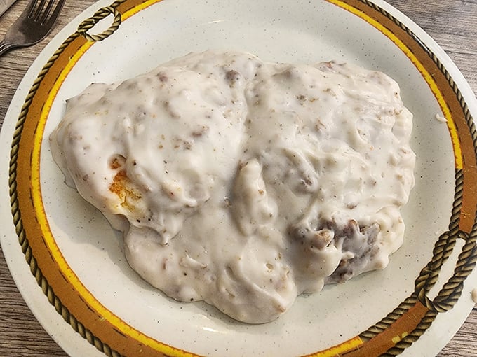 Biscuits and gravy so authentic they should come with their own Southern accent – creamy, peppery perfection that grandma would approve of.