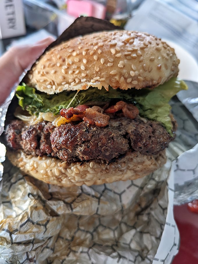 This isn't just a burger—it's a masterclass in char-grilled perfection, where every bite delivers the promise made by that tantalizing aroma.