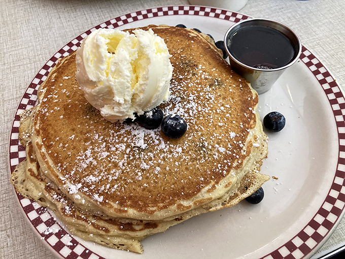 Pancakes topped with a scoop of vanilla ice cream and fresh blueberries—because sometimes breakfast should feel like you're getting away with something.