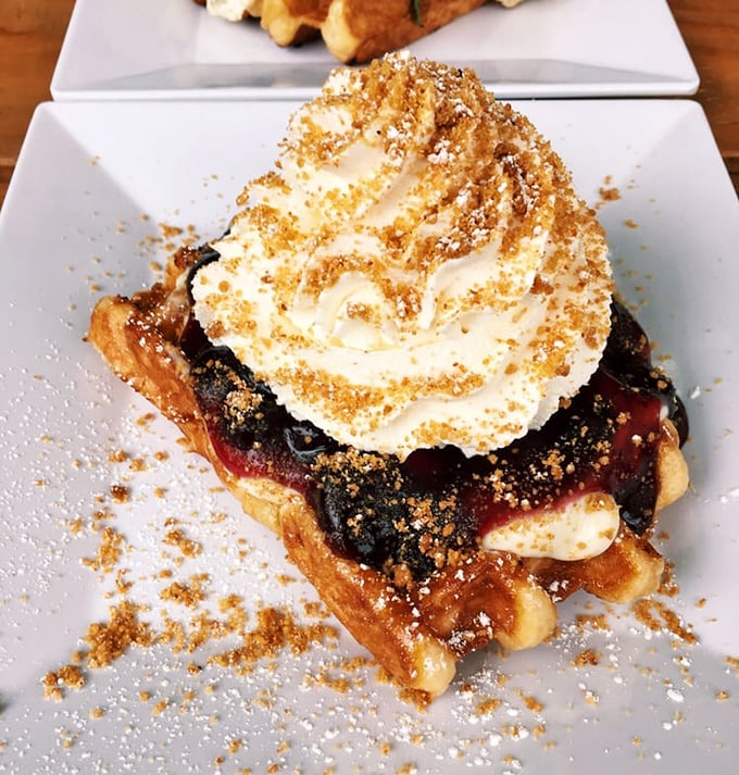 A mountain of blueberry compote and whipped cream that makes you wonder why all breakfasts don't wear crowns.
