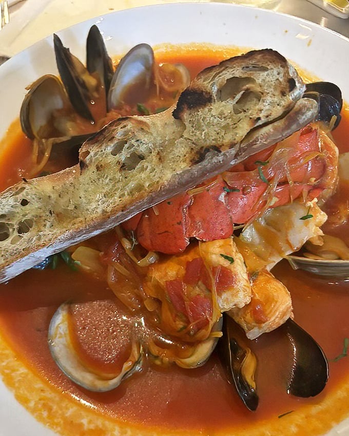 This bouillabaisse isn't just soup—it's a maritime United Nations where every seafood delegate gets along swimmingly in tomato-saffron harmony.