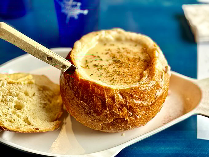Edible architecture at its finest—a sourdough bread bowl that transforms from vessel to treasure as it soaks up every last drop.