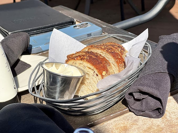 Fresh-baked bread arrives in a wire basket like a warm welcome, with butter that's actually spreadable—a small miracle in restaurant dining.