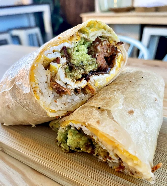 Breakfast burrito perfection—where eggs, avocado, and protein unite in tortilla harmony. The kind of portable feast worth getting out of bed for.