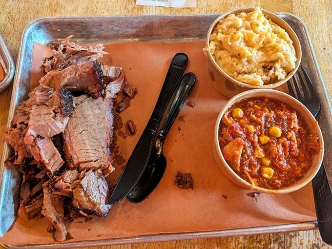 Brisket sliced thicker than a romance novel, with sides that don't just complement the meat—they throw it a full-on parade.