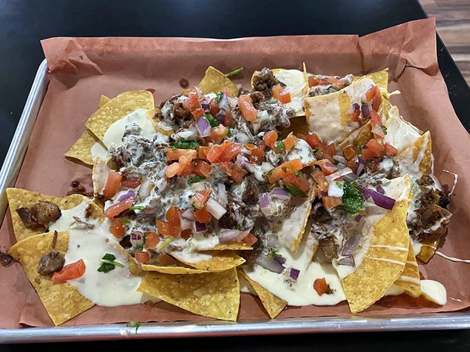 Nachos reimagined through the lens of barbecue brilliance. Chips, meat, queso, and pico creating a flavor fiesta that demands to be shared.