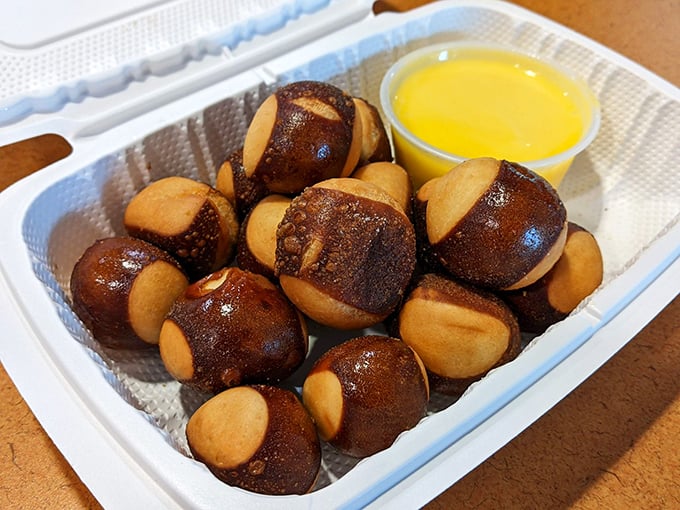 Buckeye Bites with golden dipping sauce – proof that appetizers aren't just opening acts but sometimes steal the whole show.
