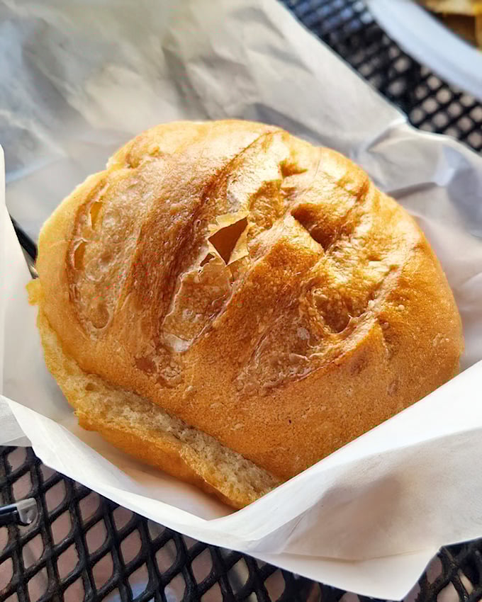 Even the bread here gets the royal treatment, arriving warm and crusty like edible sunshine in a basket.