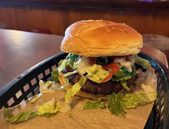 Even the burger gets the Happy Dog treatment – a testament to what happens when bar food refuses to be ordinary.