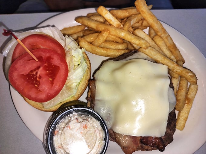 This isn't just a burger—it's a masterclass in diner perfection with melted cheese cascading over the patty like a dairy waterfall.