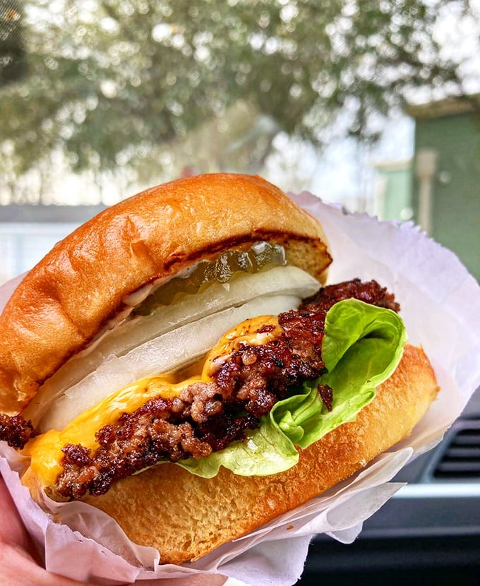 This isn't just a burger—it's edible architecture with those perfectly caramelized edges, melty cheese, and a bun that knows its supporting role.
