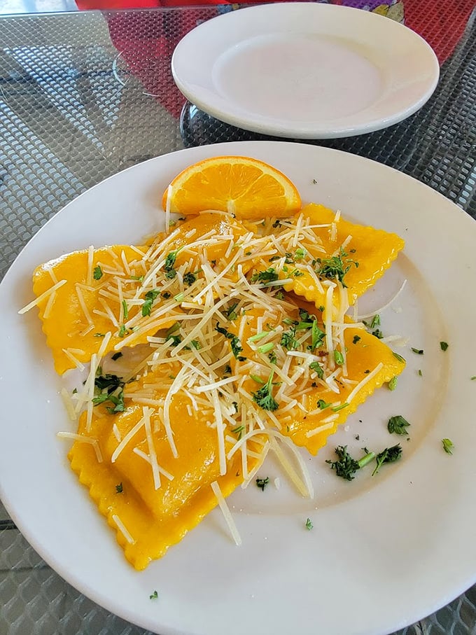 Butternut squash ravioli that looks like little pockets of sunshine, topped with fresh parmesan and herbs—comfort food that somehow feels sophisticated.