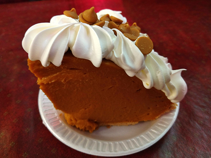 Pumpkin pie that would make your grandmother both jealous and proud. That mountain of whipped cream isn't just decoration—it's necessity.