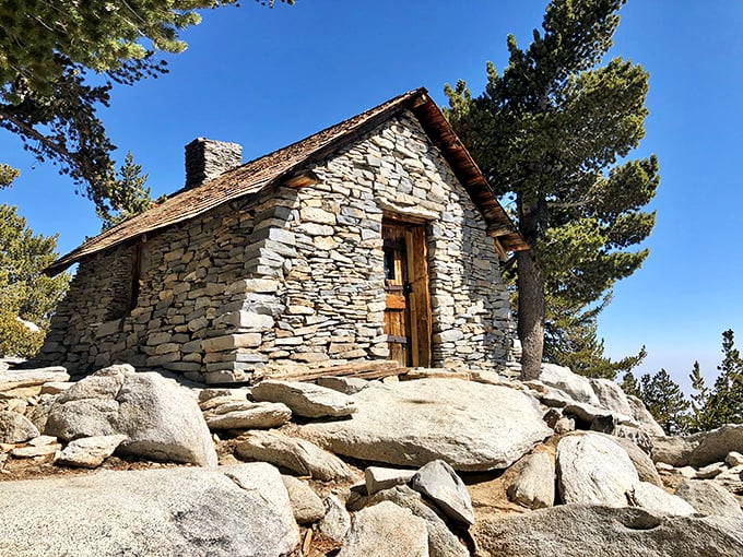 This historic stone cabin has weathered more storms than your favorite denim jacket. Simple, sturdy, and impossibly photogenic against the granite backdrop.