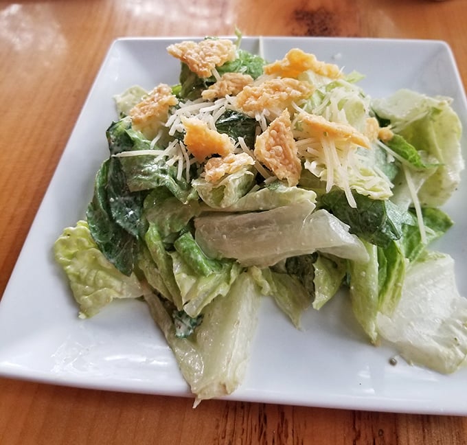 A classic Caesar salad that Julius himself would approve of—crisp romaine, sharp Parmesan, and crunchy croutons in perfect harmony.