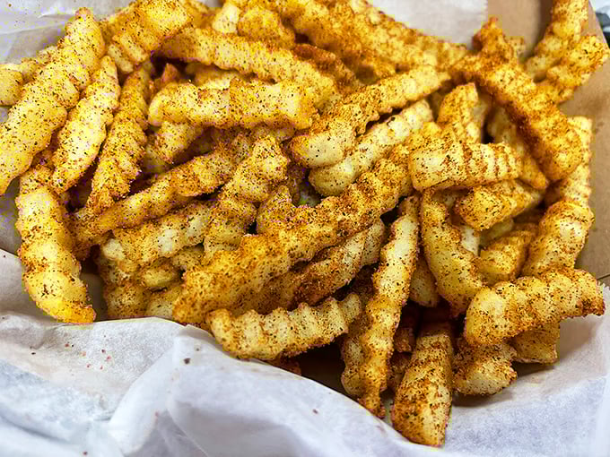Cajun fries that crackle with personality – crispy, seasoned soldiers standing at attention, ready for their delicious duty.
