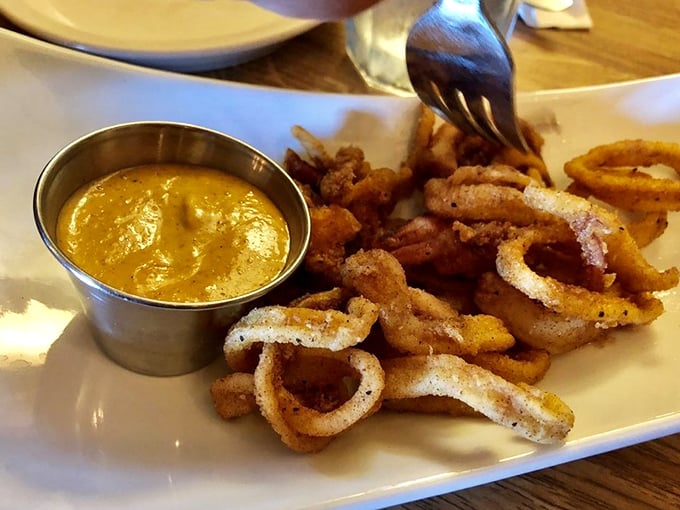 Crispy calamari that shatters with each bite, paired with a dipping sauce that makes you wonder why you'd ever eat seafood any other way.