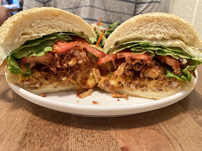 The sandwich that launched a thousand road trips. Seafood nestled in fresh bread with crisp veggies—simplicity at its most delicious.