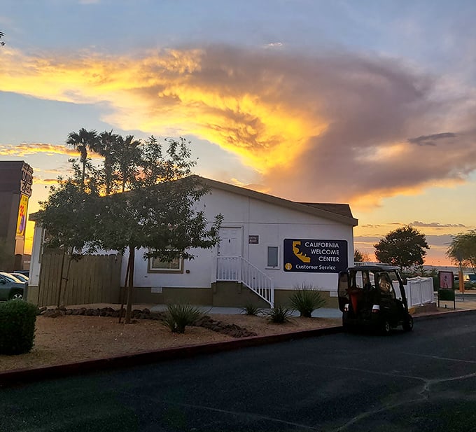 The California Welcome Center greets visitors with the warm glow of a desert sunset, serving as the first handshake to the Golden State.