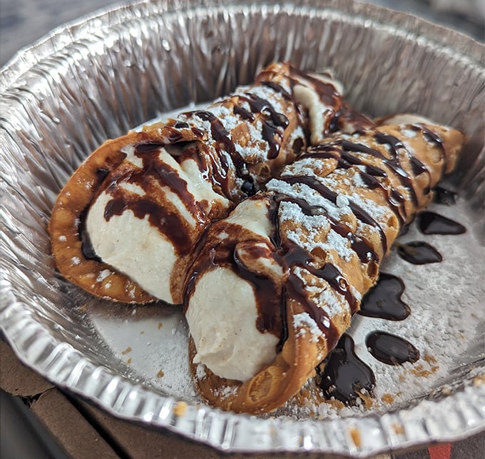 Cannoli that would make your Italian grandmother nod in approval—if your grandmother was cool enough to appreciate chocolate drizzle artistry.
