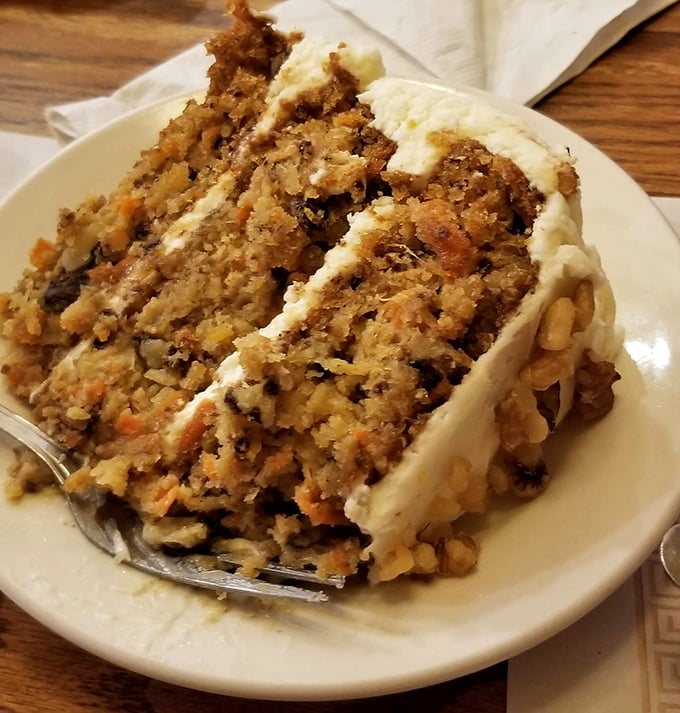 Carrot cake that actually contains visible carrots—revolutionary! Those layers of cream cheese frosting are negotiating with your willpower, and winning.