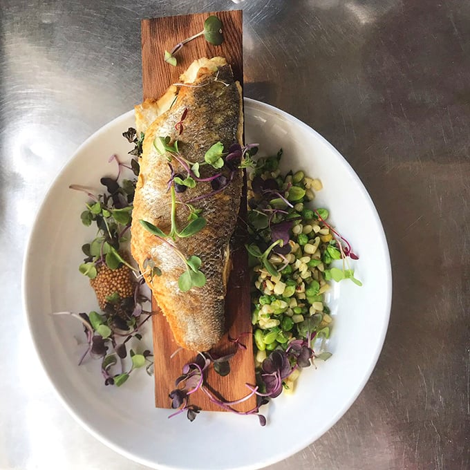 This cedar plank Bronzino is the seafood equivalent of showing up to a casual dinner in a tuxedo – impressively dressed yet perfectly at home.