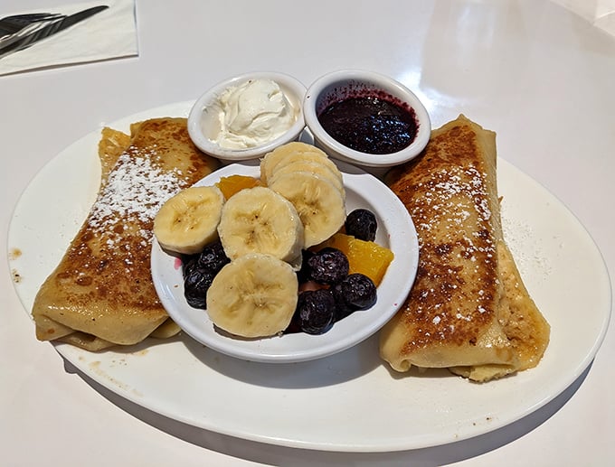 Cheese blintzes with fresh fruit and cream—like pancakes went to college, got sophisticated, but still know how to have fun.