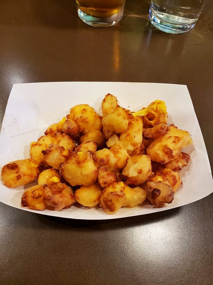 These cheese curds aren't just fried, they're transformed – like Clark Kent stepping into a phone booth and emerging as Superman, but tastier.