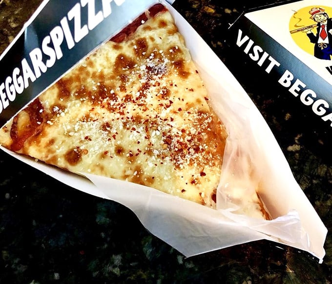 The cheese pizza that launched a thousand cravings – simple ingredients transformed into something that makes you wonder why anyone adds toppings at all.
