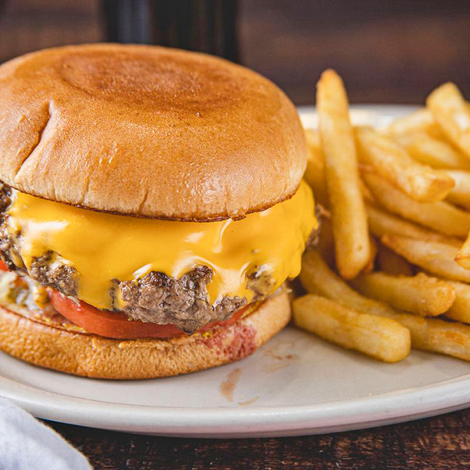 This isn't just a cheeseburger—it's a testament to simplicity done right, with melted American cheese hugging that beef patty like it never wants to let go.