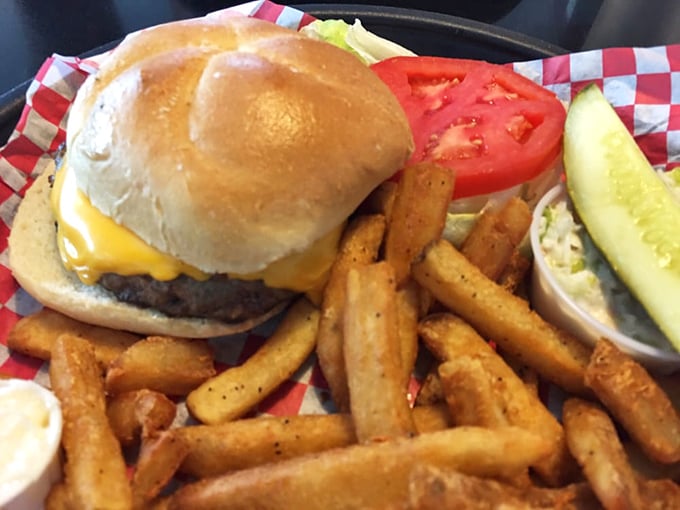 The cheeseburger arrives like a work of art—golden bun, melted cheese, fresh toppings, and those seasoned fries that somehow disappear faster than you intended.