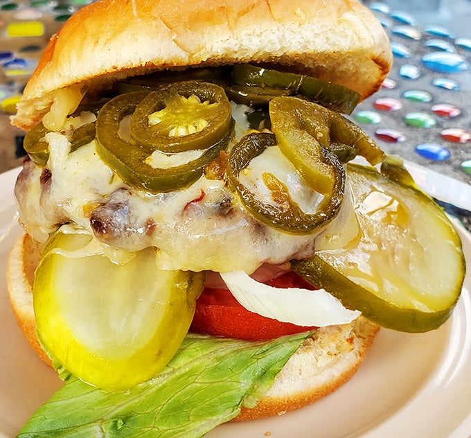 Jalapeños and pickles add a zingy personality to this cheeseburger masterpiece. It's not showing off—it's just being delicious.