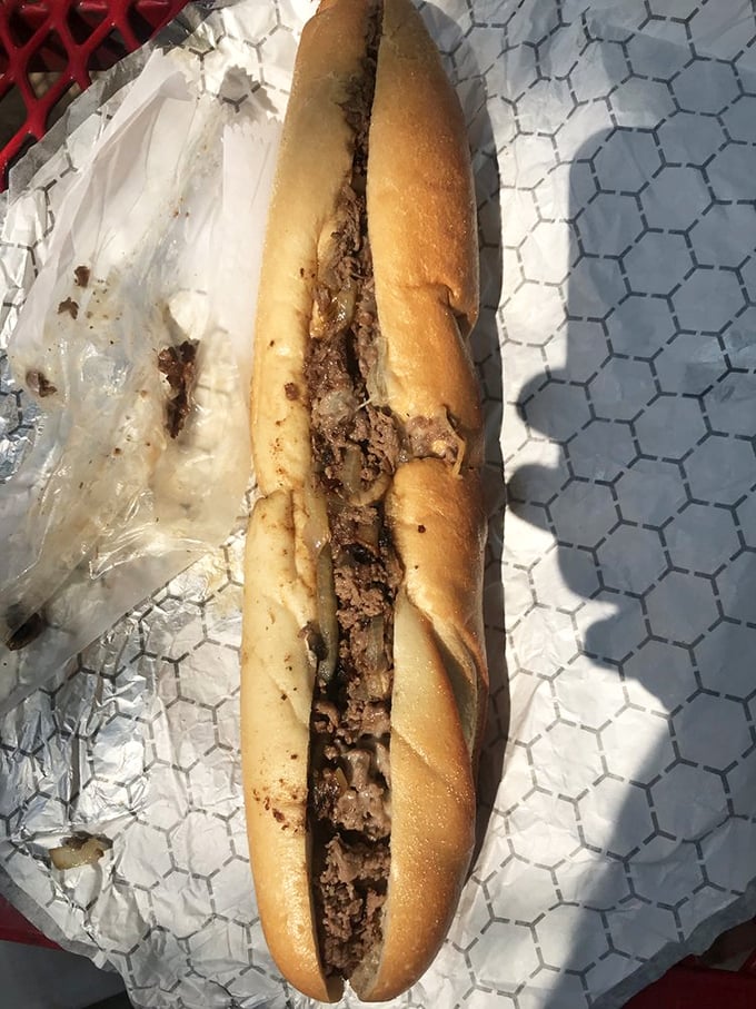 The cheesesteak in its natural habitat – simple, unpretentious, and absolutely packed with meat. Pennsylvania perfection on a roll.