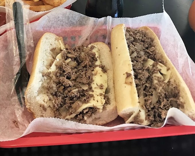 The classic Philly cheesesteak in its natural habitat. Thinly sliced beef and melted cheese nestled in a fresh roll—simplicity that conquered the world.
