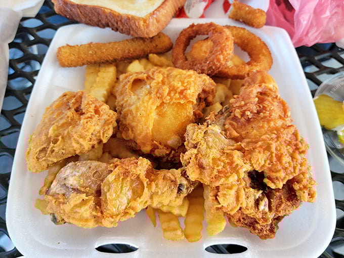Fried chicken that would make your grandmother both jealous and proud—crispy, golden armor protecting juicy meat within.