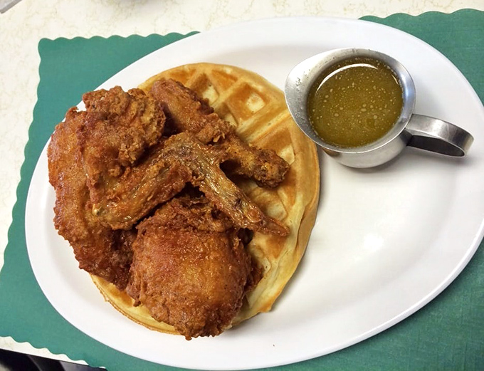 The chicken and waffle plate—where sweet meets savory in a dance as old as time, with maple syrup playing matchmaker.