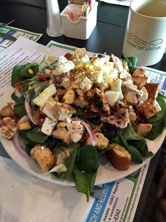 The legendary chicken finger salad – where crispy meets fresh in a plate-sized masterpiece that's worth every mile of the drive.