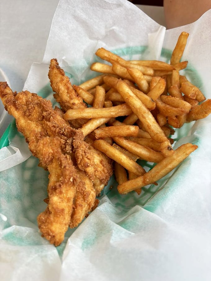 Chicken tenders and fries—proof that sometimes the simplest pleasures are the most satisfying, especially when hand-breaded with this much care.