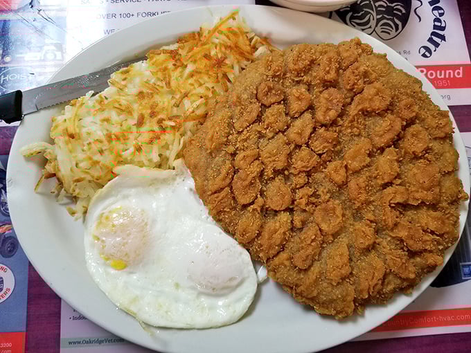 This chicken fried steak isn't just dinner—it's an Oklahoma tradition the size of a small county, with crispy edges that crackle with each bite.