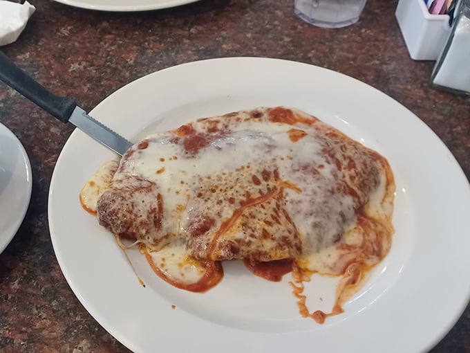Behold the chicken parm in all its saucy, cheesy glory—where Italian-American comfort meets Pennsylvania hospitality under a blanket of melted mozzarella.