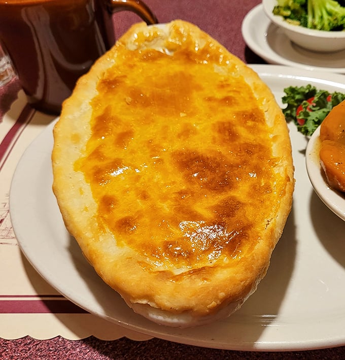 Golden-topped chicken pot pie that looks like it graduated from comfort food university with highest honors. The crust alone deserves a medal.