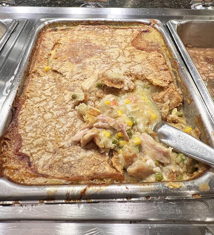 Beneath that golden crust lies a chicken pot pie that whispers, "Don't worry about that diet today—we have important comfort food business to attend to."