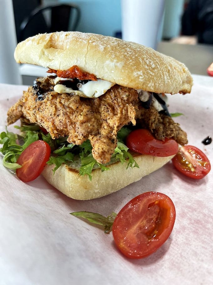 A chicken sandwich that doesn't just raise the bar – it completely redefines what poultry between bread can achieve.