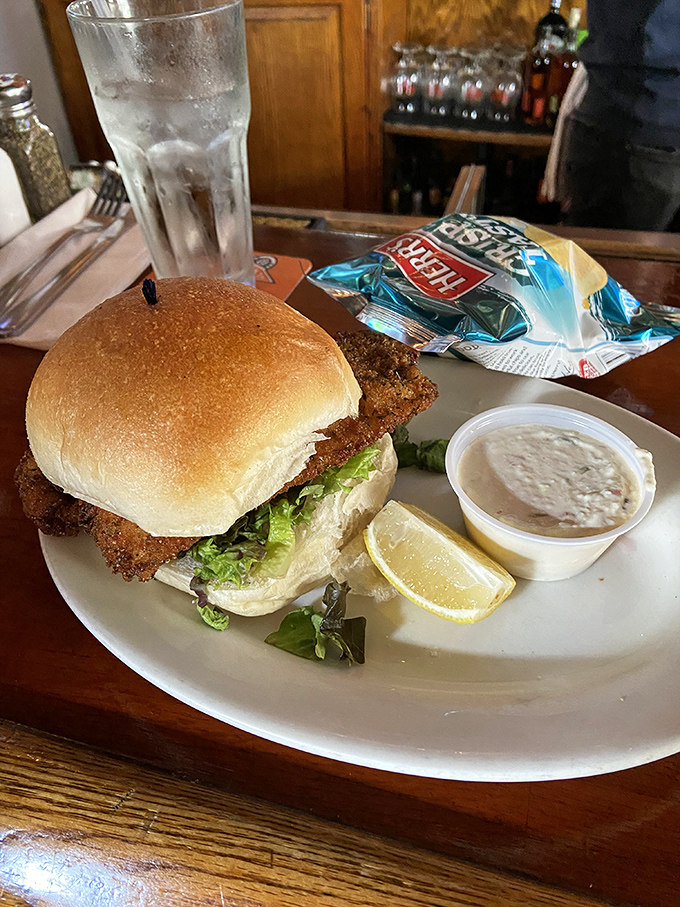 This sandwich isn't just lunch – it's edible architecture, with crispy chicken, fresh veggies, and a bun that's somehow both sturdy and cloud-soft.