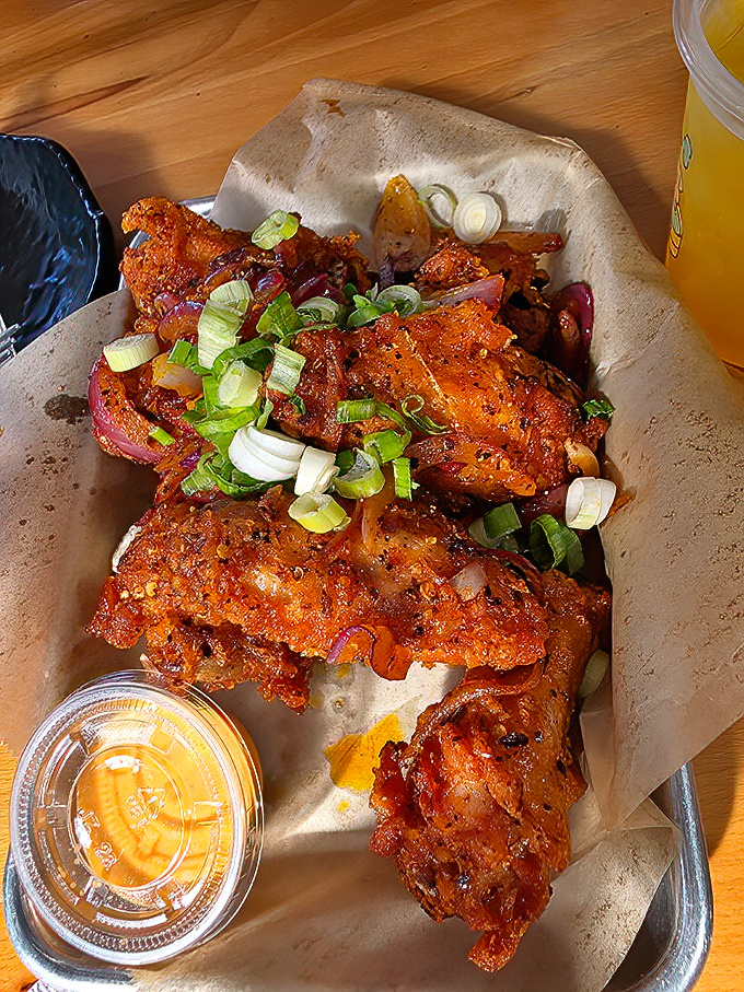 These aren't your average wings—they're crispy, flavor-packed messengers of joy that'll have you licking your fingers with zero shame.