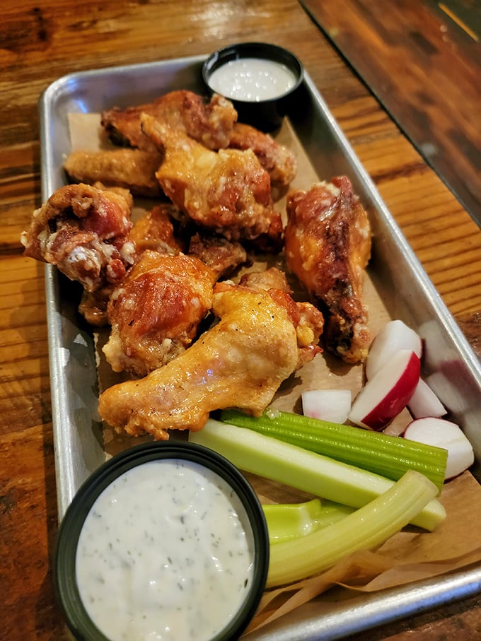 Wings that strike the perfect balance between crispy exterior and juicy interior. The celery and dipping sauces aren't afterthoughts—they're essential supporting characters.