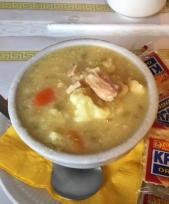 Fred's Famous Chicken Dumpling soup—where chunks of tender chicken and pillowy dumplings swim in broth that tastes like your grandmother's kitchen on a Sunday.