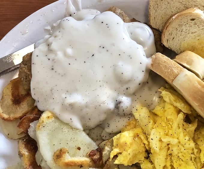 Country gravy cascading over potatoes and eggs—a breakfast worthy of champions or anyone who plans to nap afterward. Calories don't count on vacation.