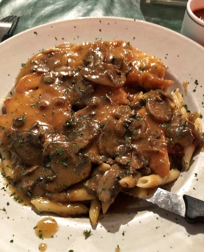 Chicken marsala that doesn't just sit on the pasta—it has a conversation with it. Those mushrooms aren't mere ingredients; they're flavor ambassadors in a rich, glossy sauce.